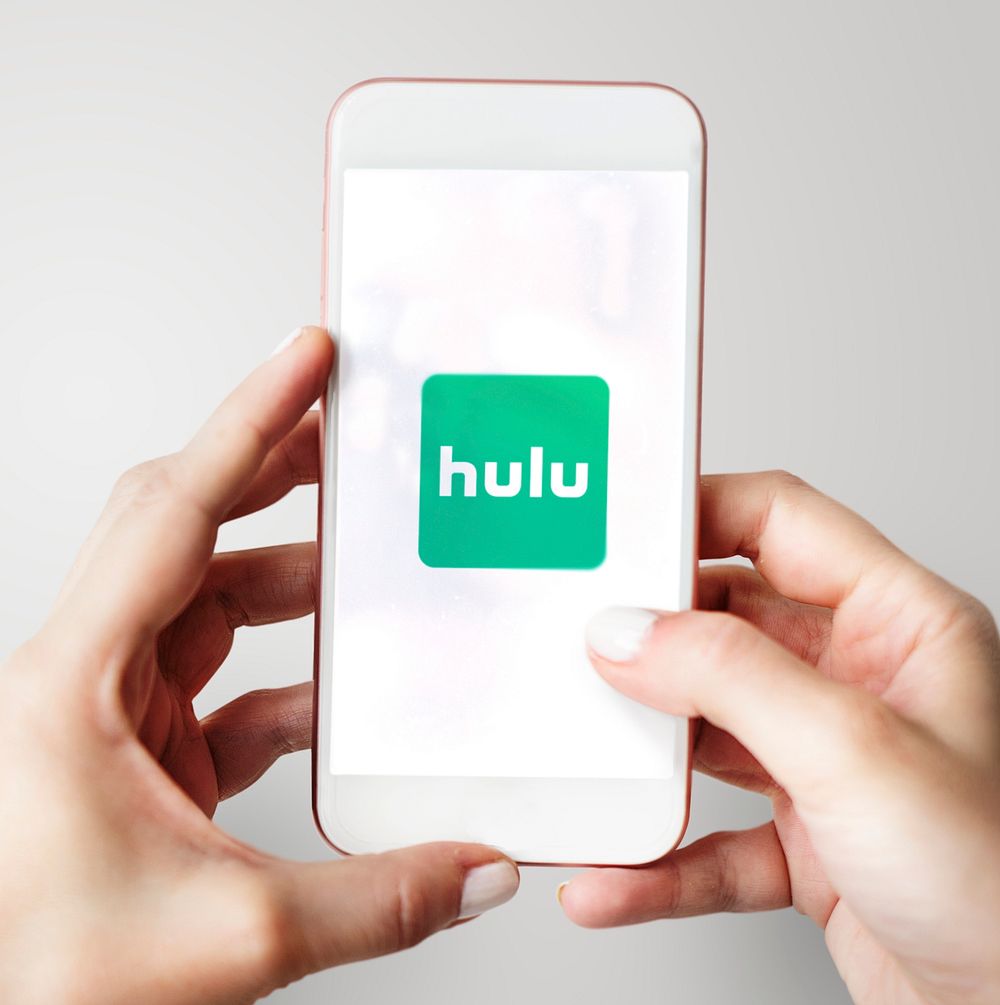 Person watching Hulu on a phone | Free Photo - rawpixel