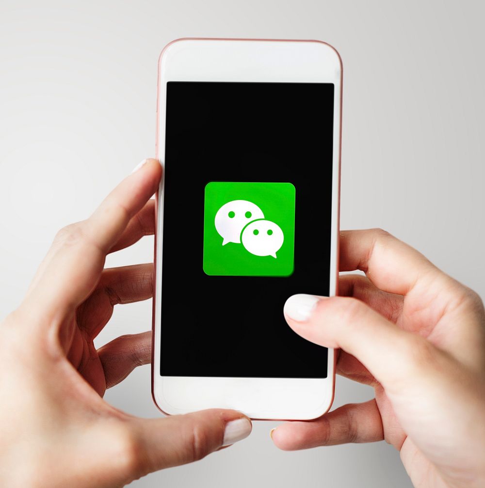 Person using WeChat application phone. | Free Photo - rawpixel