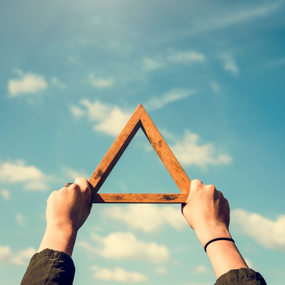 Hands Holding Triangle Symbol Cloudscape | Premium Photo - rawpixel