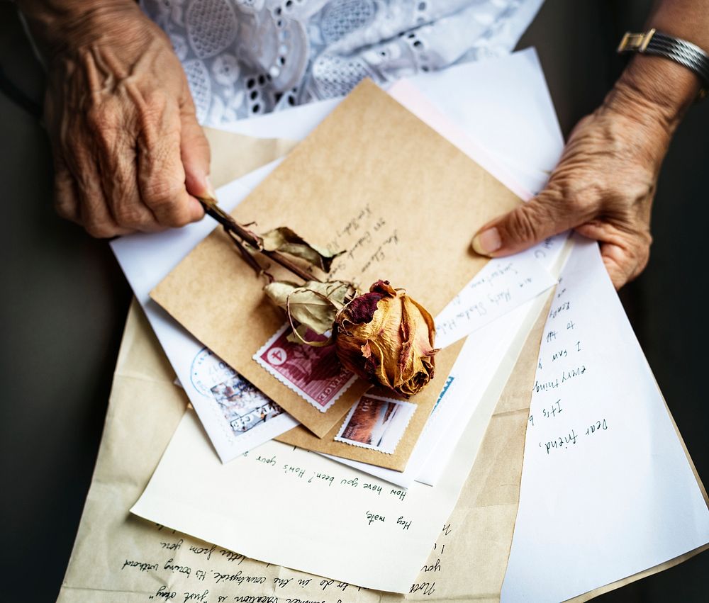 Elderly woman holding old letters | Premium Photo - rawpixel