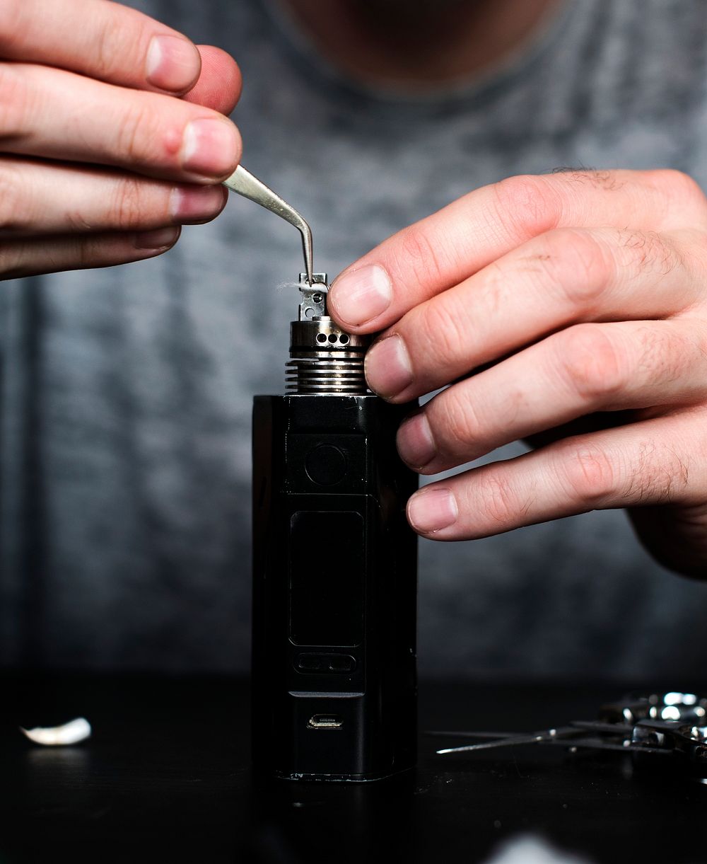 Fixing a vape device | Premium Photo - rawpixel
