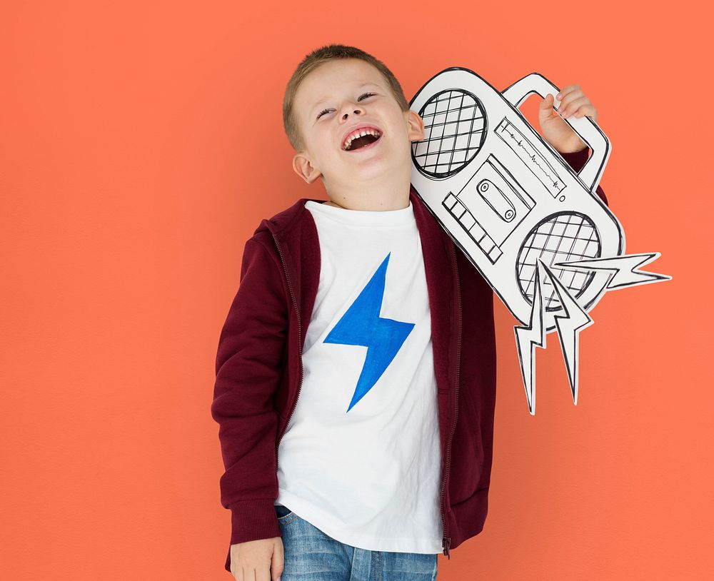 Caucasian Little Boy Holding Jukebox | Premium Photo - rawpixel