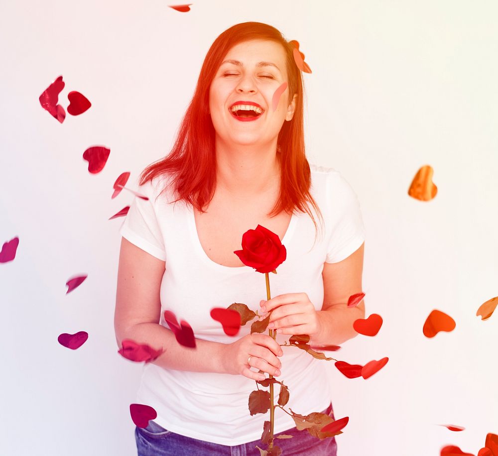 Woman smiling and holding rose | Premium Photo - rawpixel