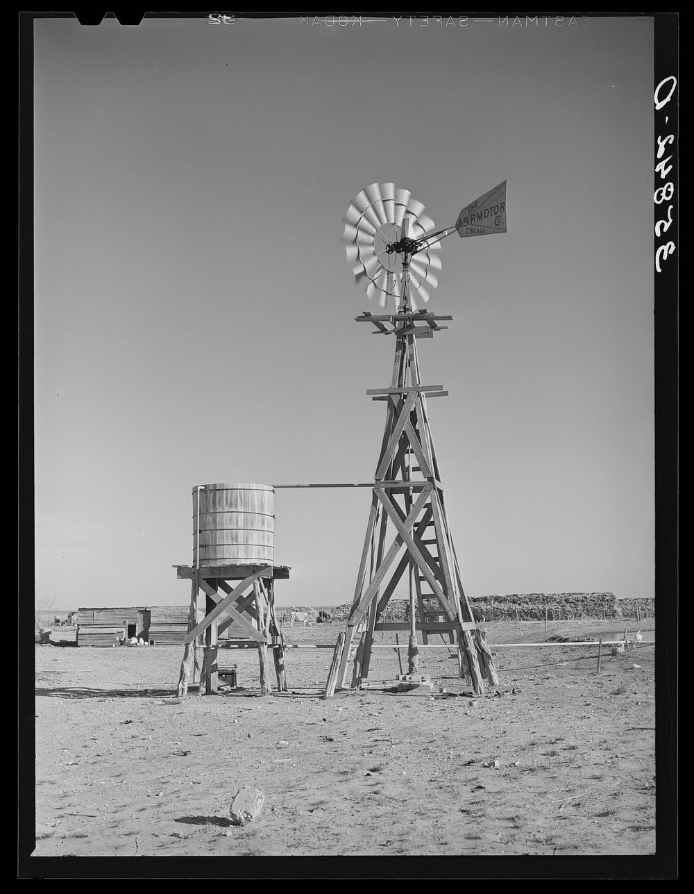 Windmill and water storage tank | Free Photo - rawpixel