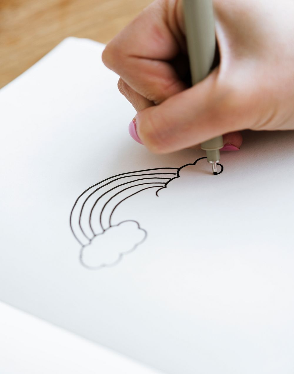 Girl doodling a rinbow in a notebook | Free Photo - rawpixel